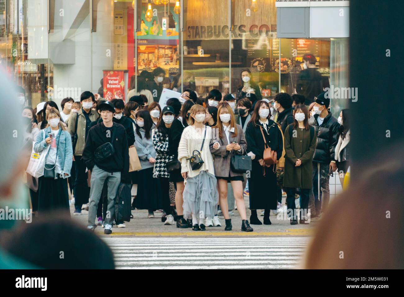 A crowd of pedestrian waiting for the traffic light at Shibuya scramble ...