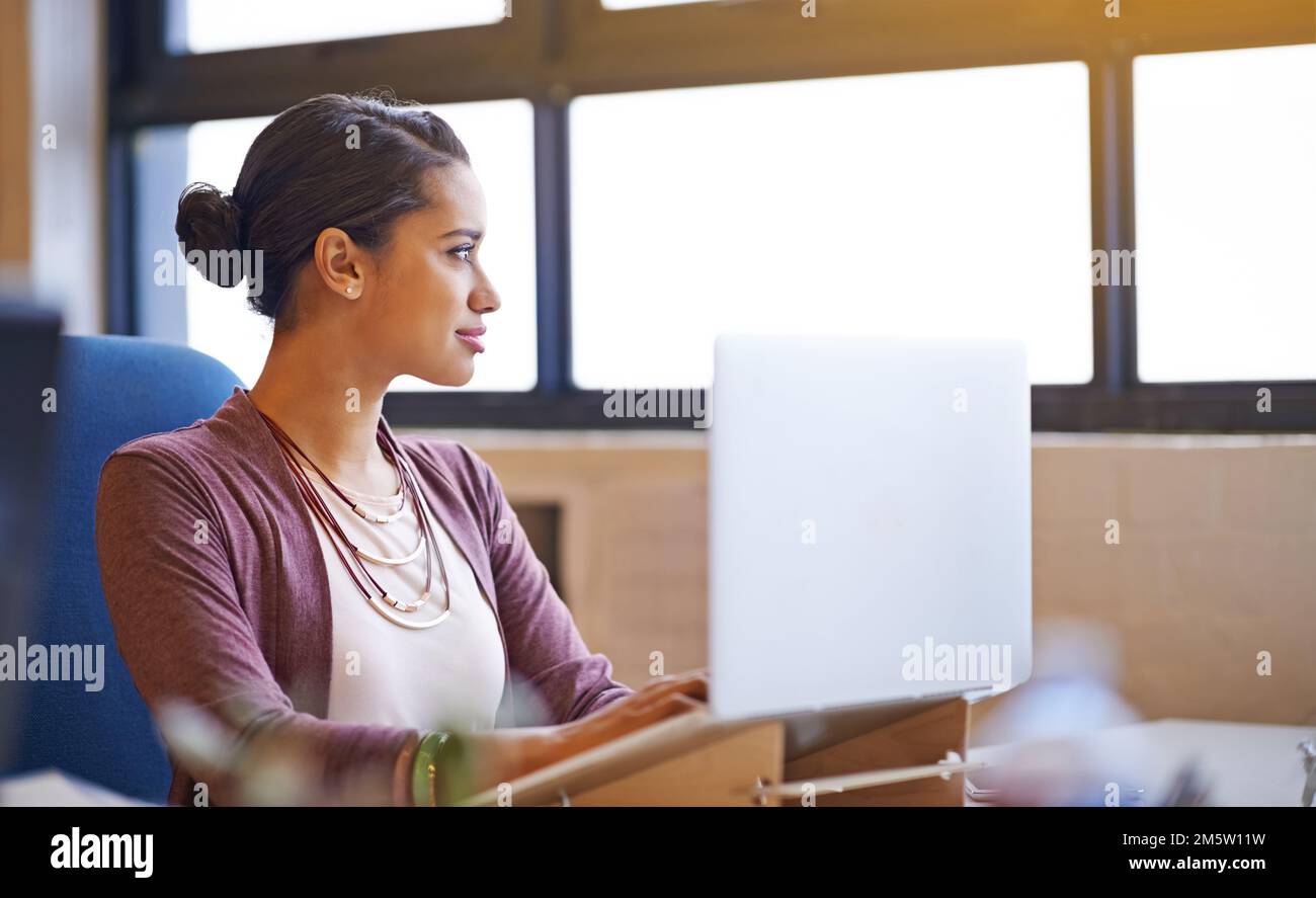 Woman working focused on laptop hi-res stock photography and images - Alamy