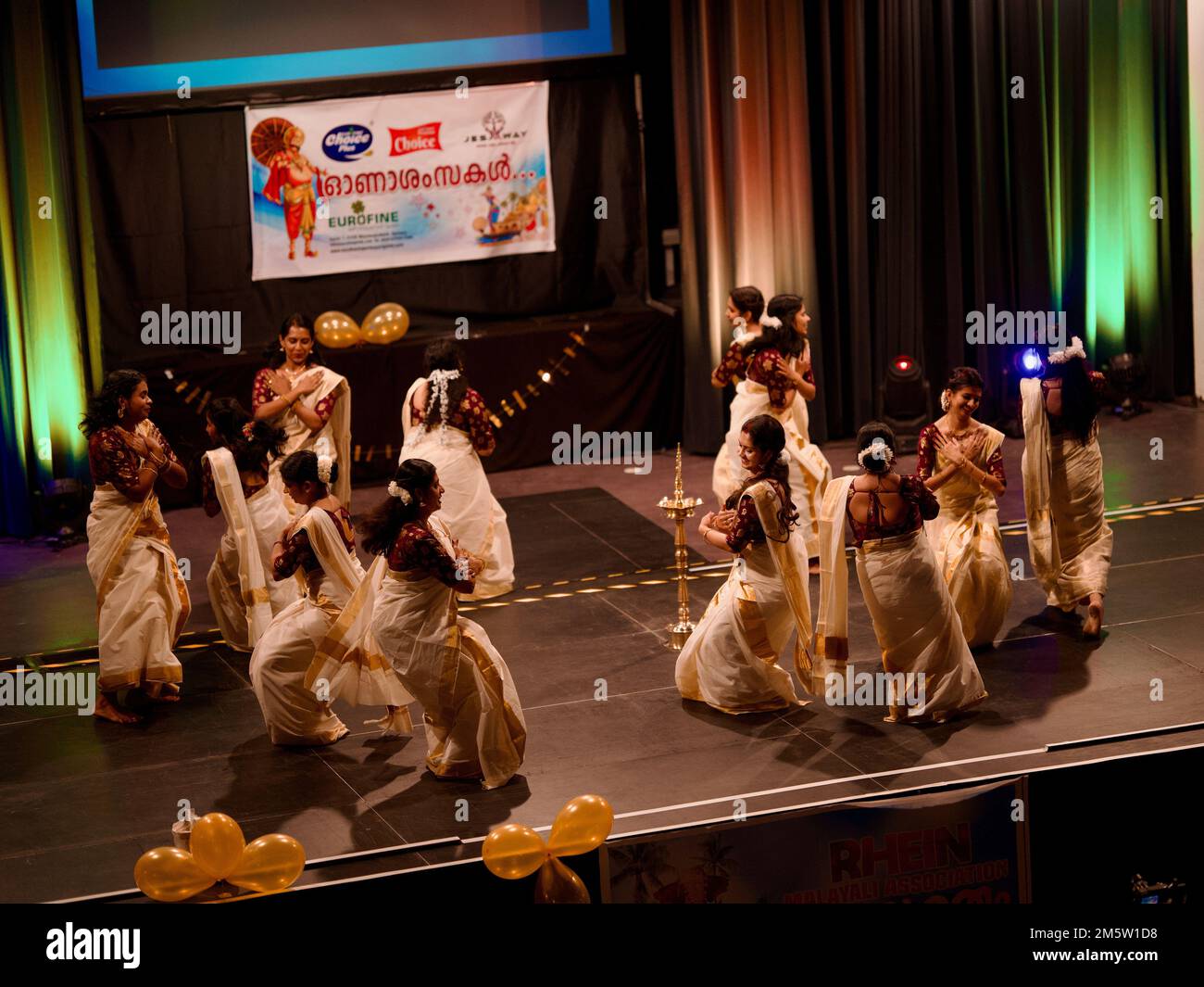 Beautiful Indian girls in traditional dresses performing a welcome ...