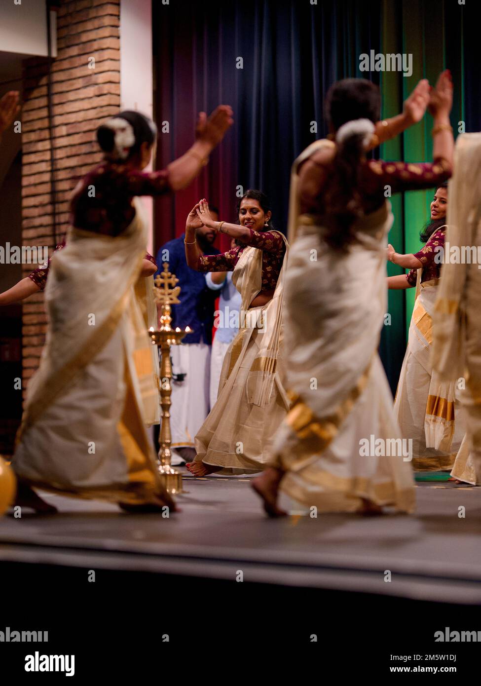 Beautiful Indian girls in traditional dresses performing a welcome ...