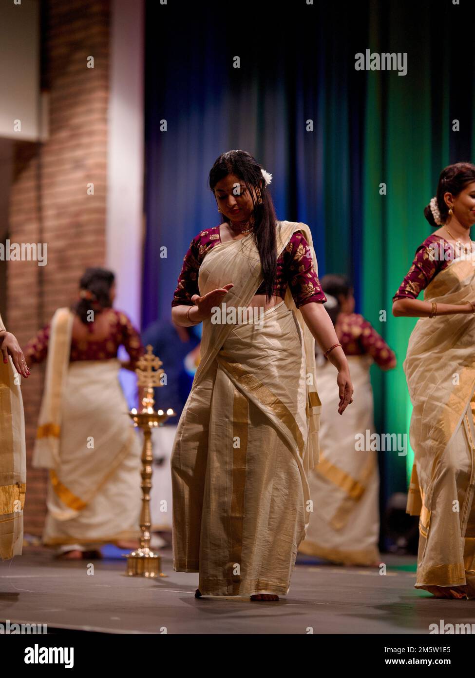 Beautiful Indian girls in traditional dresses performing a welcome ...