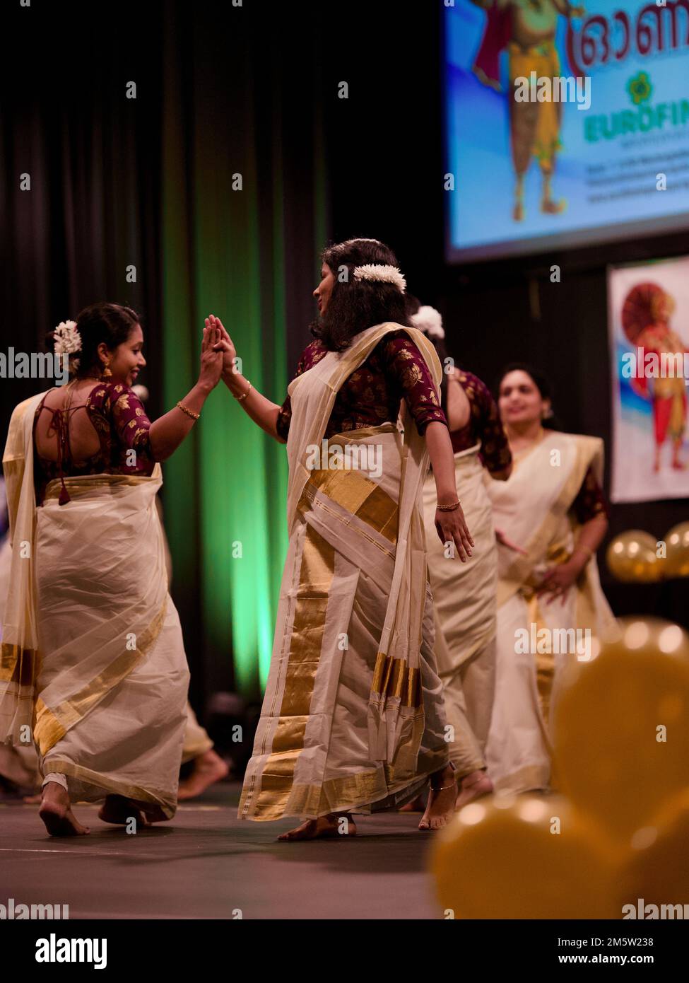 Beautiful Indian girls in traditional dresses performing a welcome ...