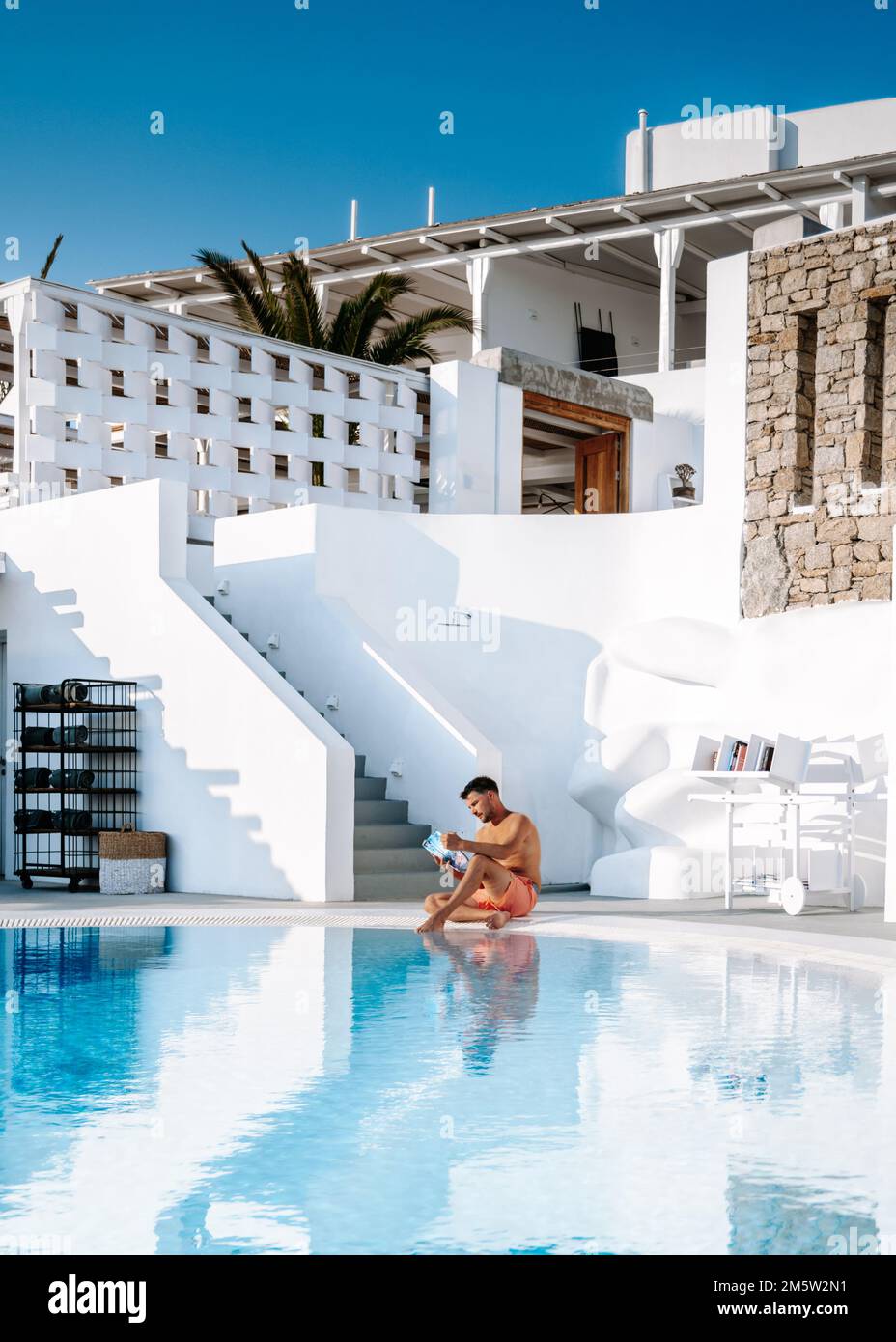 Person reading in pool hi-res stock photography and images - Alamy