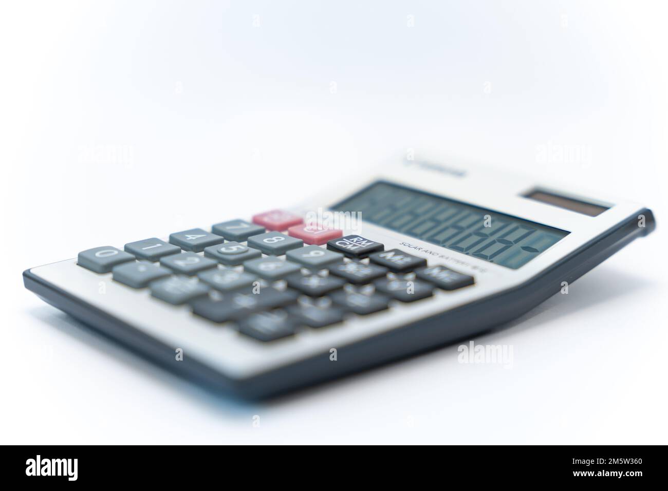 A white digital calculator isolated on white background. Calculator ...