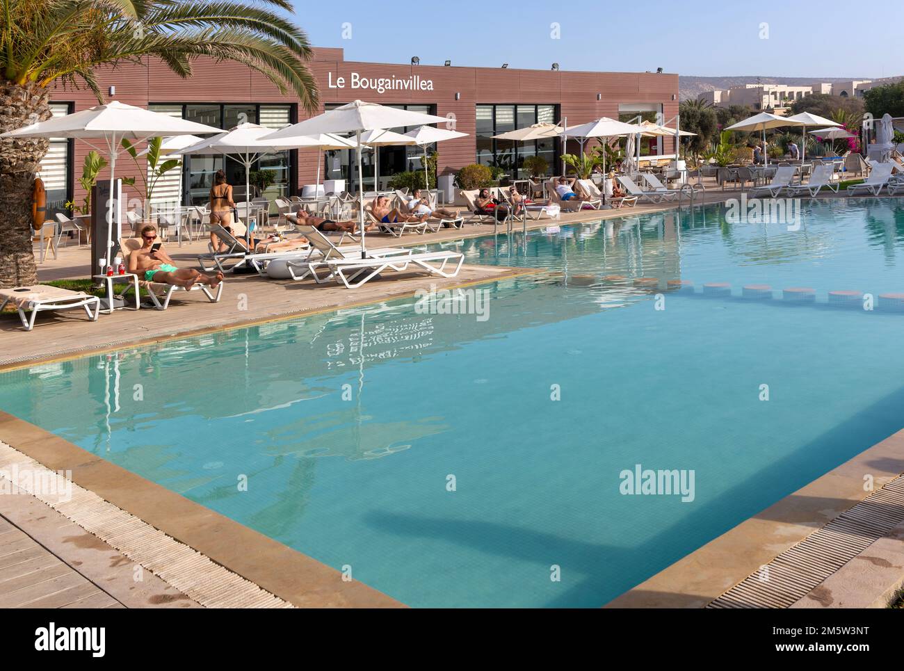 Tourists at swimming pool, Radisson Blu Resort, Taghazout Bay Surf ...