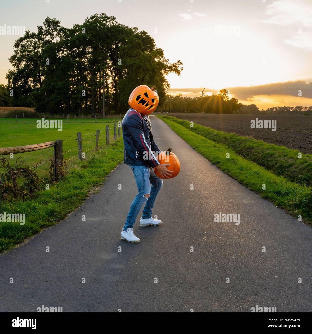 A male wearing pumpkin on head Stock Photo - Alamy