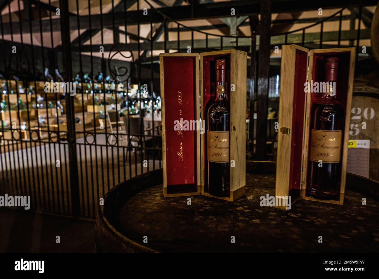 Two cases of luxury Armagnac bottles, a sort of grape brandy wine of ...