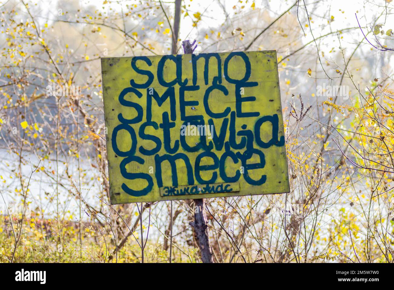 Wooden warning sign, at the entrance to the forest Stock Photo - Alamy