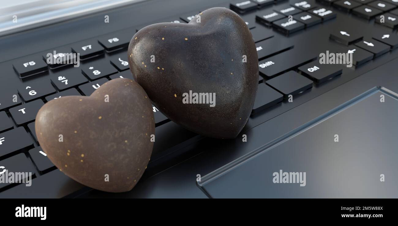 Chocolate Candy heart shape on laptop keyboard background. Valentine ...