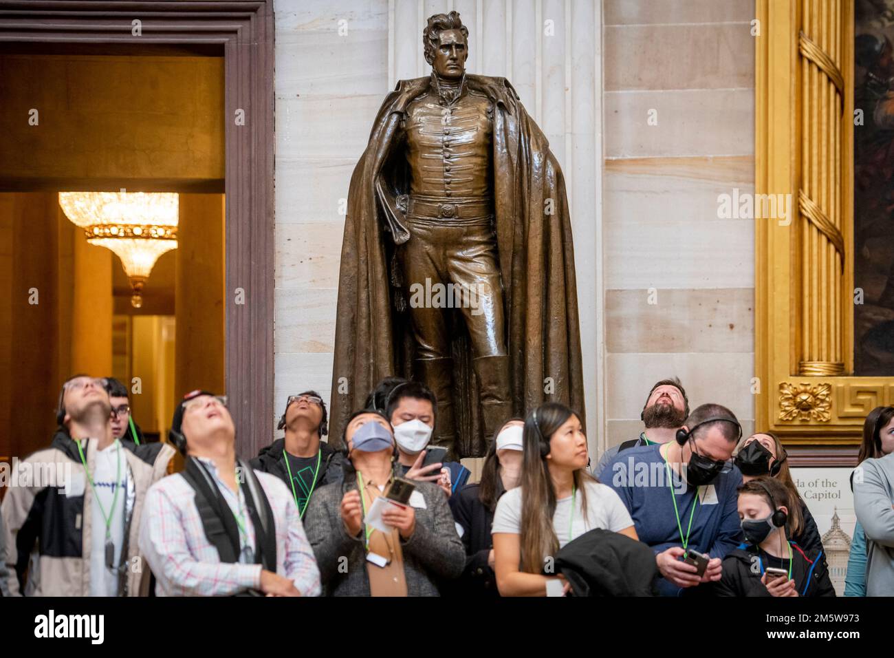 Washington DC, USA. 30th Dec, 2022. Tourists stand under a statue of former US President Andrew ...