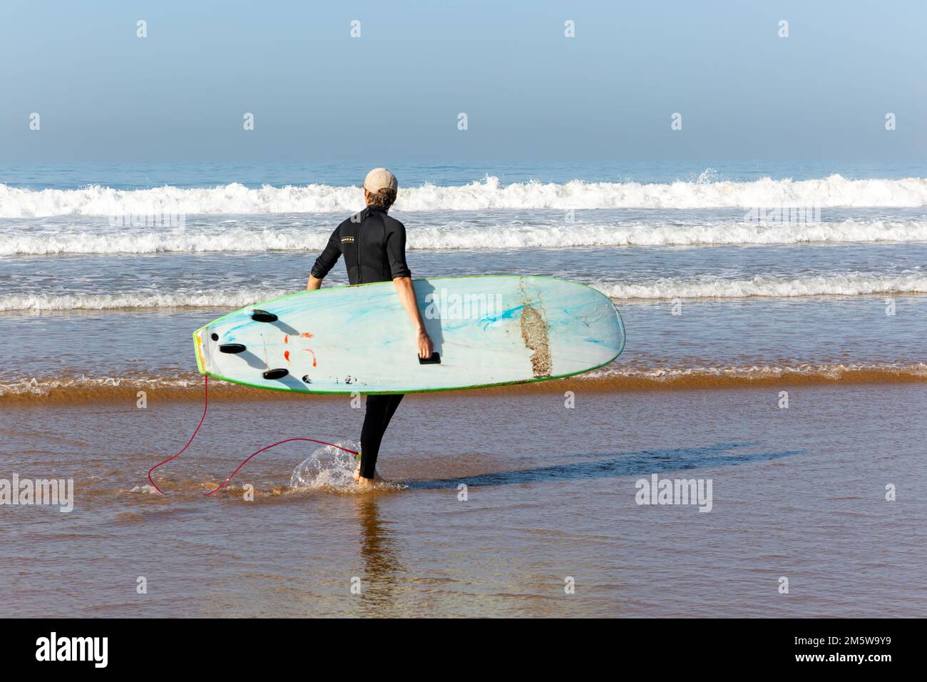 Person surfing in Atlantic Ocean on beach, Taghazout, Morocco, North ...