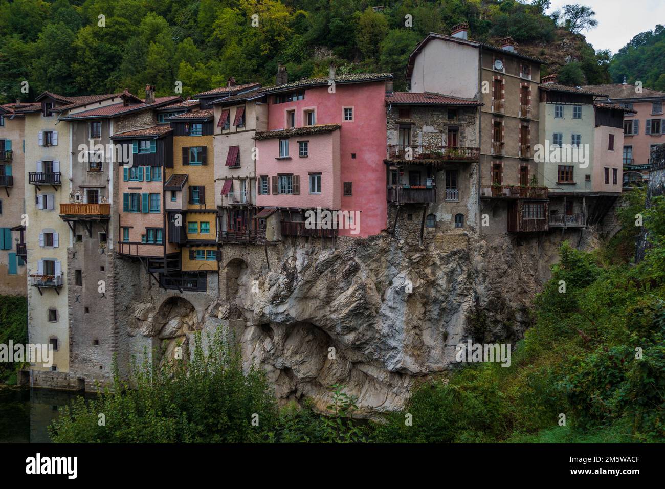 The facade of hanging houses of Pont en Royans in France Stock Photo ...