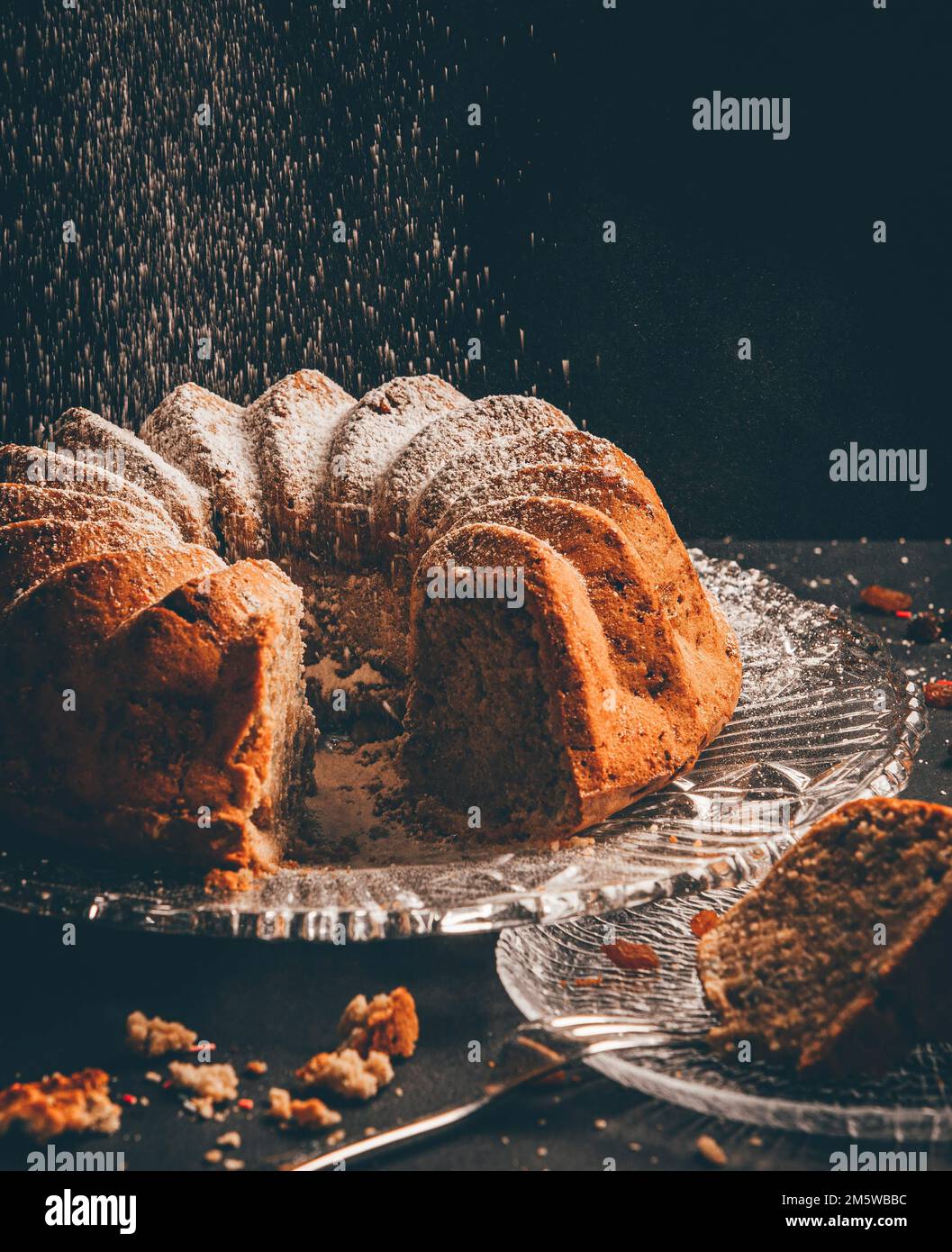 Cake with falling sugar Stock Photo - Alamy