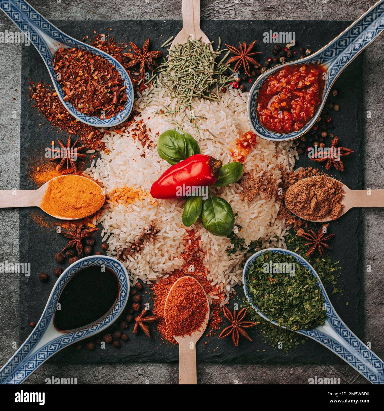 Rice with spices, paprika (Capsicum), parsley (Petroselinum crispum ...