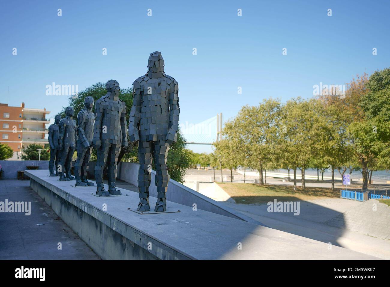 Row of iron statues of humans Stock Photo - Alamy
