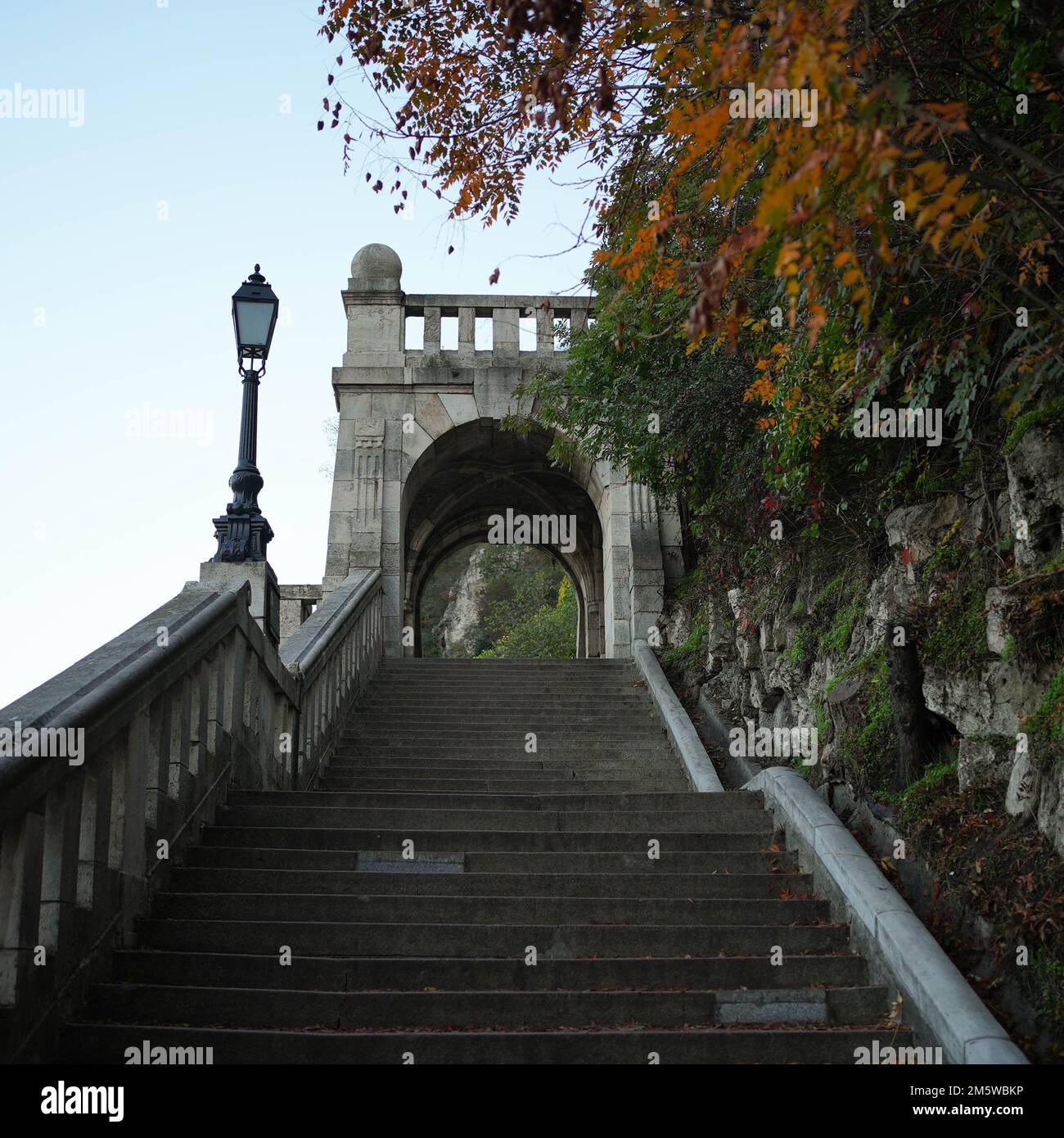 Stairs leading up to an old stone gate monument Stock Photo - Alamy