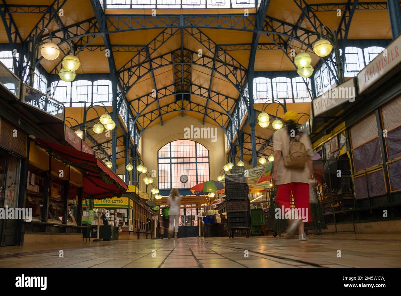 People passing inside a fancy old market hall Stock Photo - Alamy