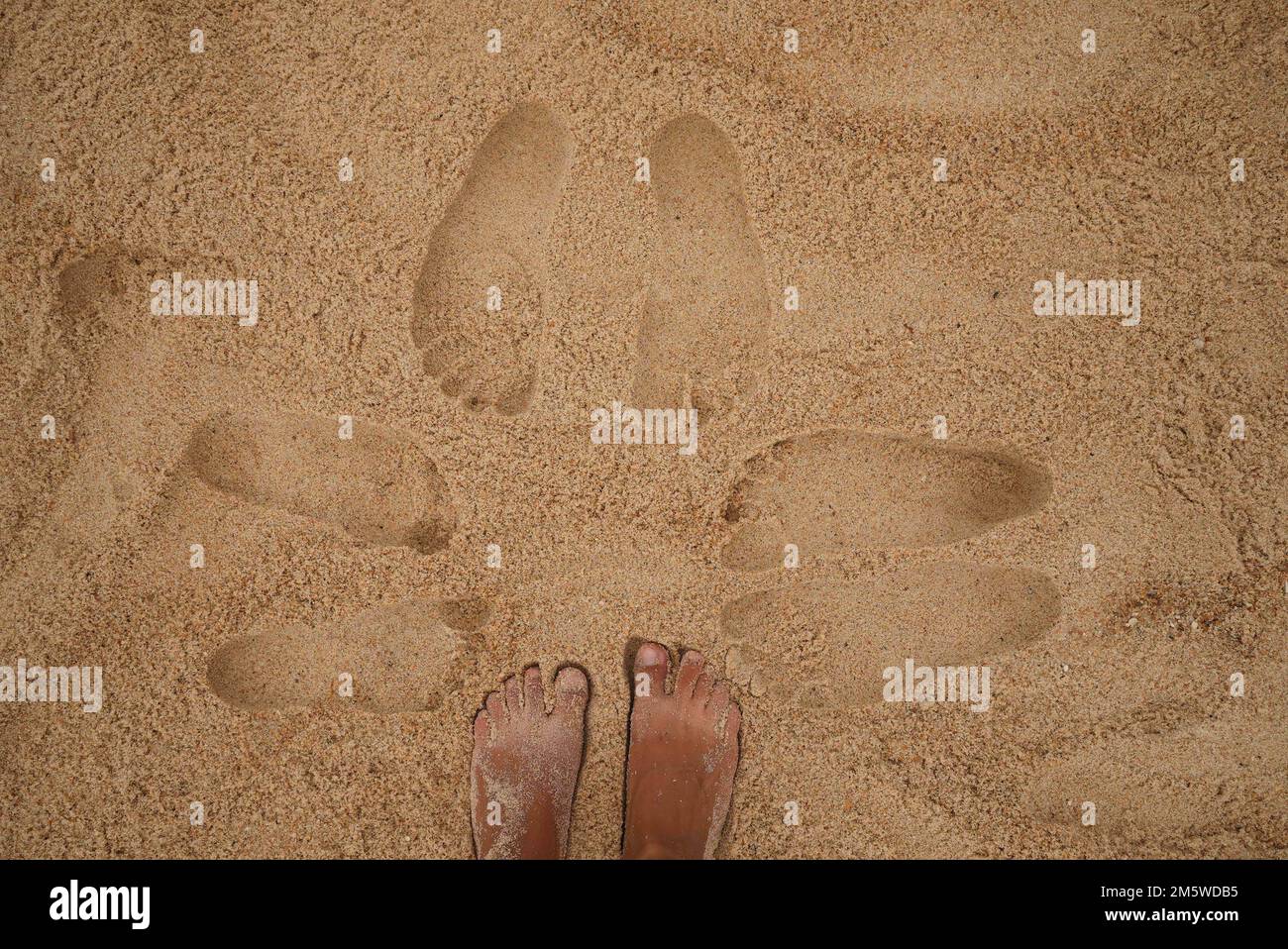 Footprints in the sand and feet Stock Photo - Alamy