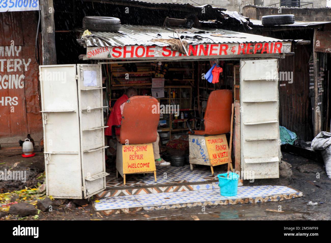 Nairobi, Kenya. 27th Dec, 2022. A shoe shiner repair shop in Kibera ...