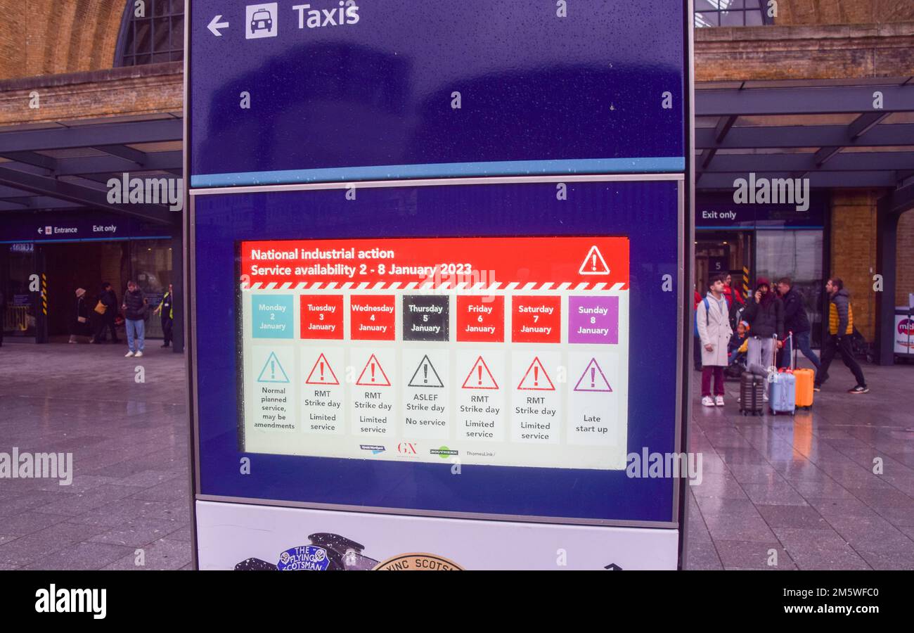 London, UK. 31st December 2022. A sign at King's Cross station informs travellers of the ...