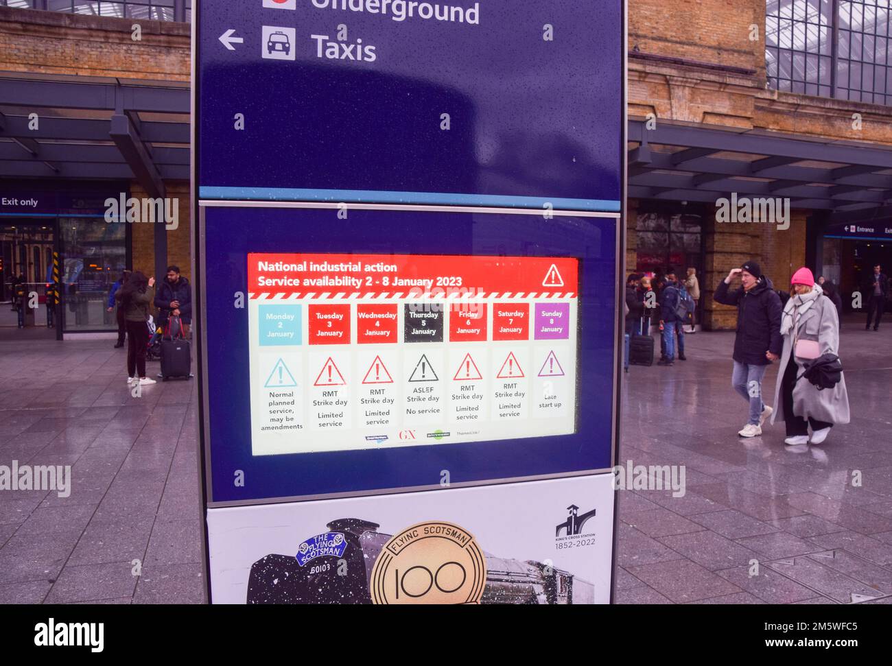 London, UK. 31st December 2022. A sign at King's Cross station informs travellers of the ...