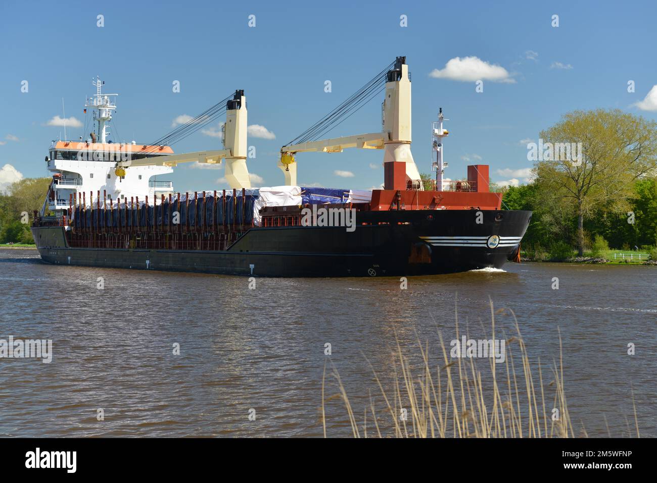 Cargo ship in the Kiel Canal, Germany Stock Photo - Alamy