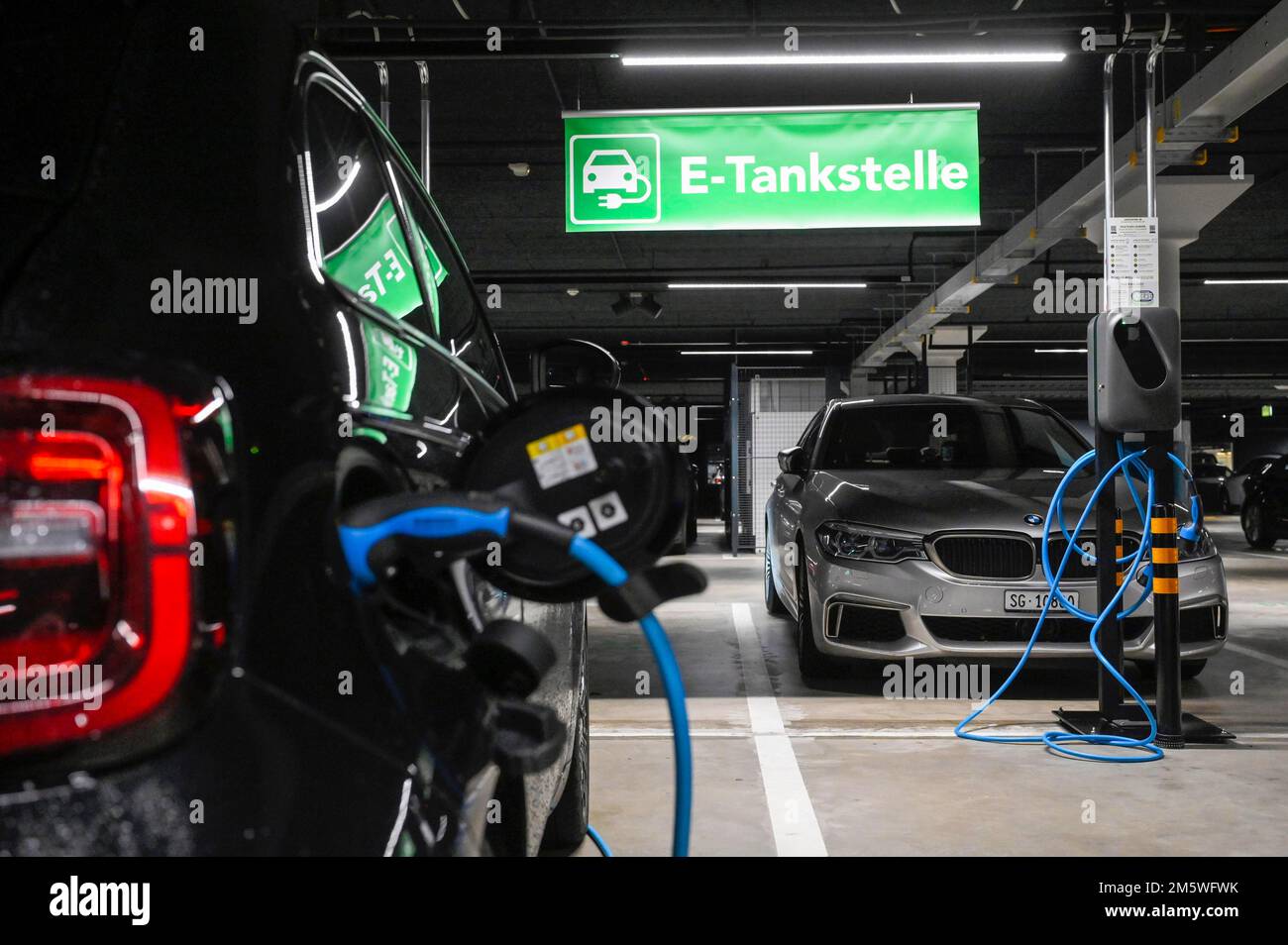 Parking garage E-filling station Electric cars Stock Photo - Alamy