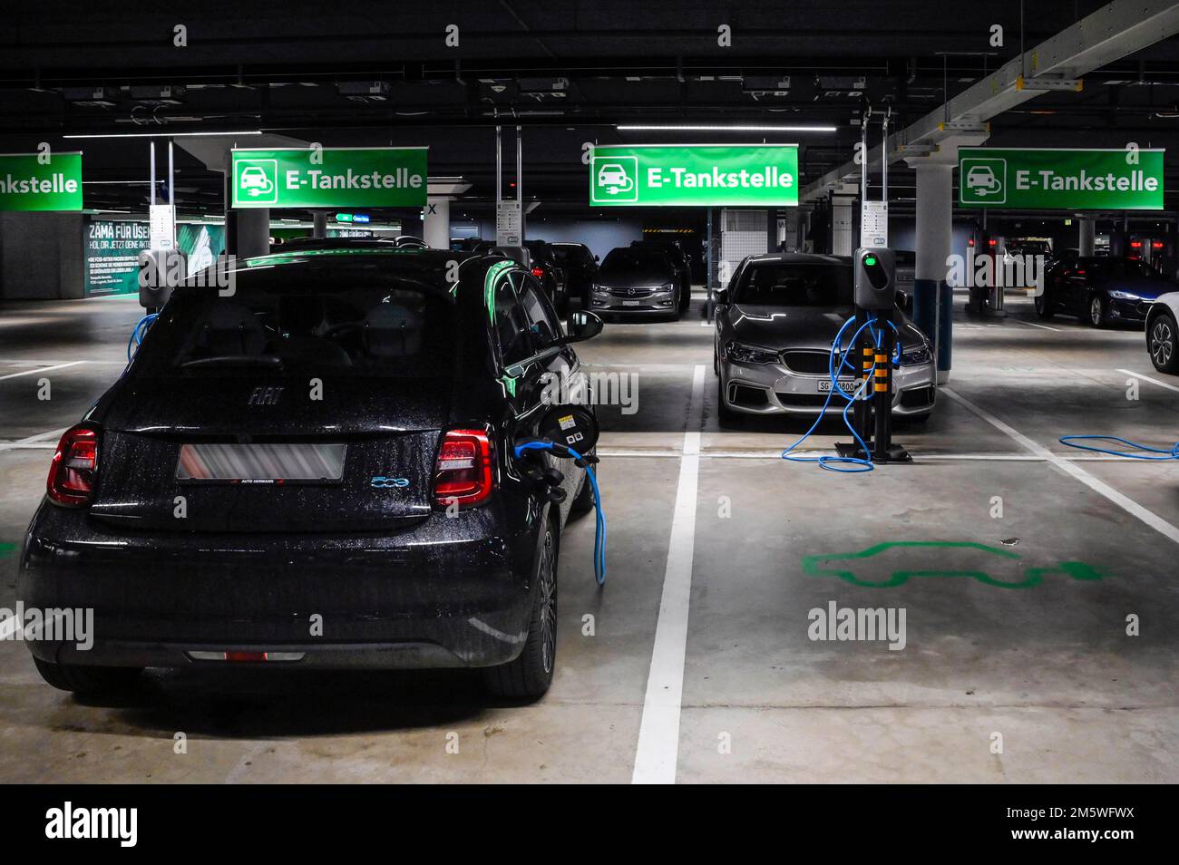 Parking garage E-filling station Electric cars Stock Photo - Alamy