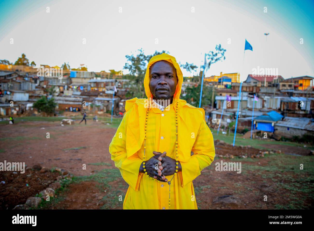 Steven Ouma praying at a Legion Maria worship ground in Kibera Slum of ...