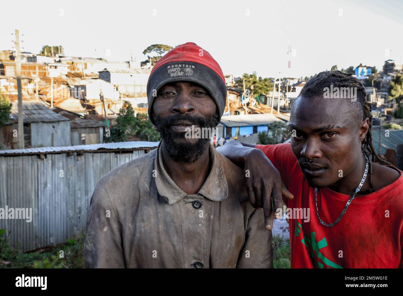 Nairobi, Kenya. 29th Dec, 2022. Men pose for a photo by the streets in ...