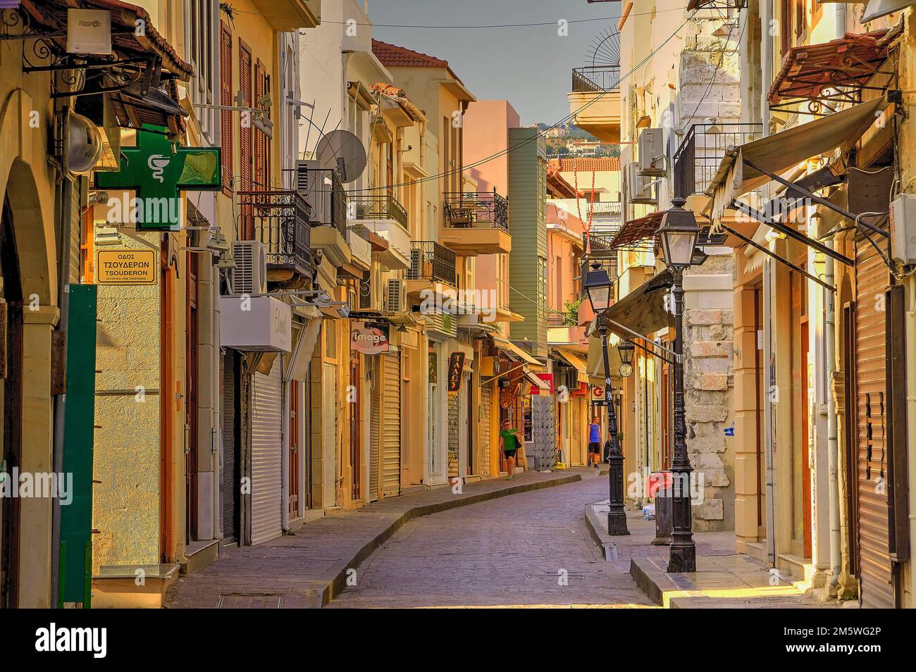 Venetian old town, old town alley almost deserted, colourful houses ...