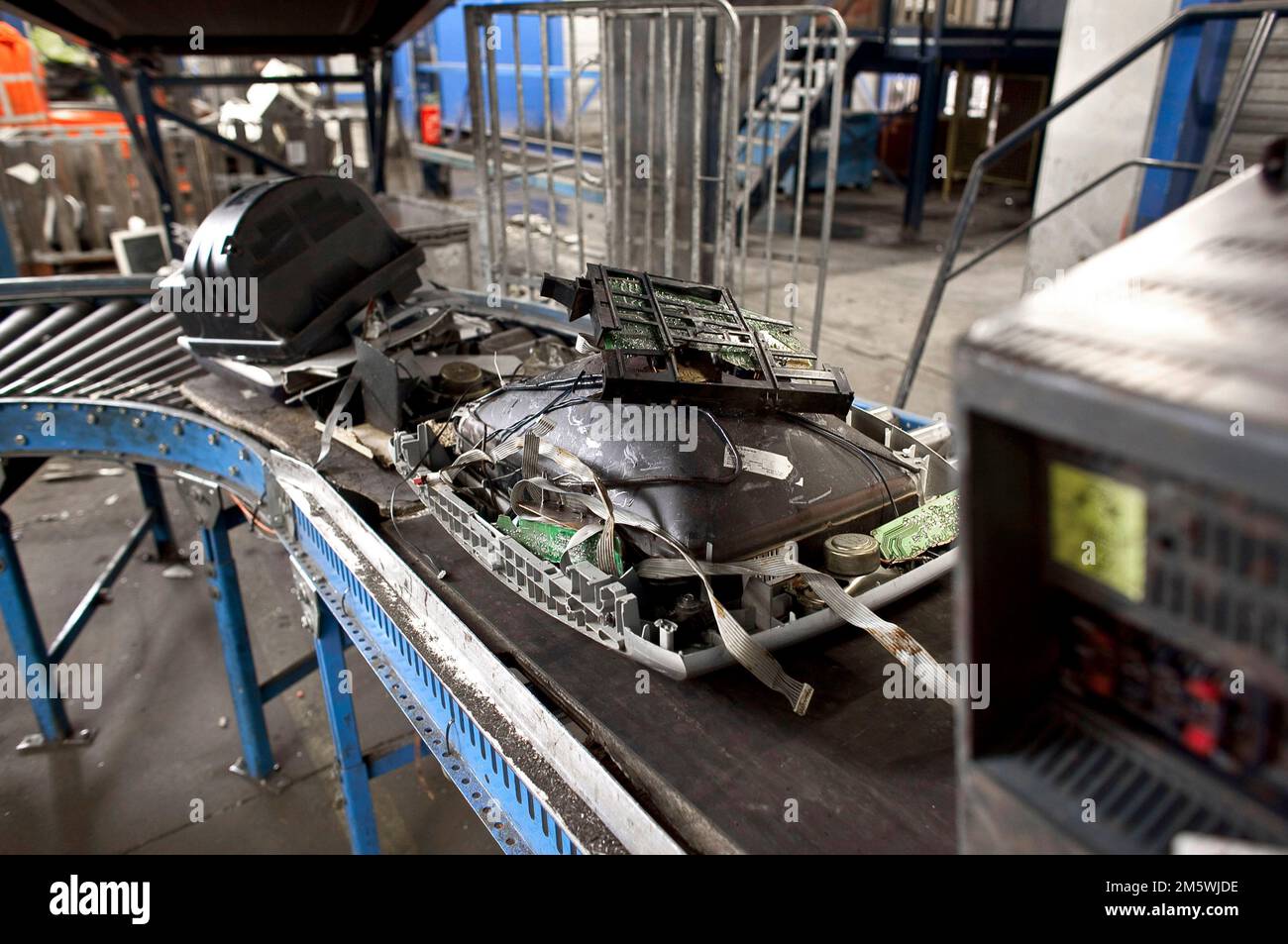 E-waste. Electronics recycling by sims, dismantling televisions ...
