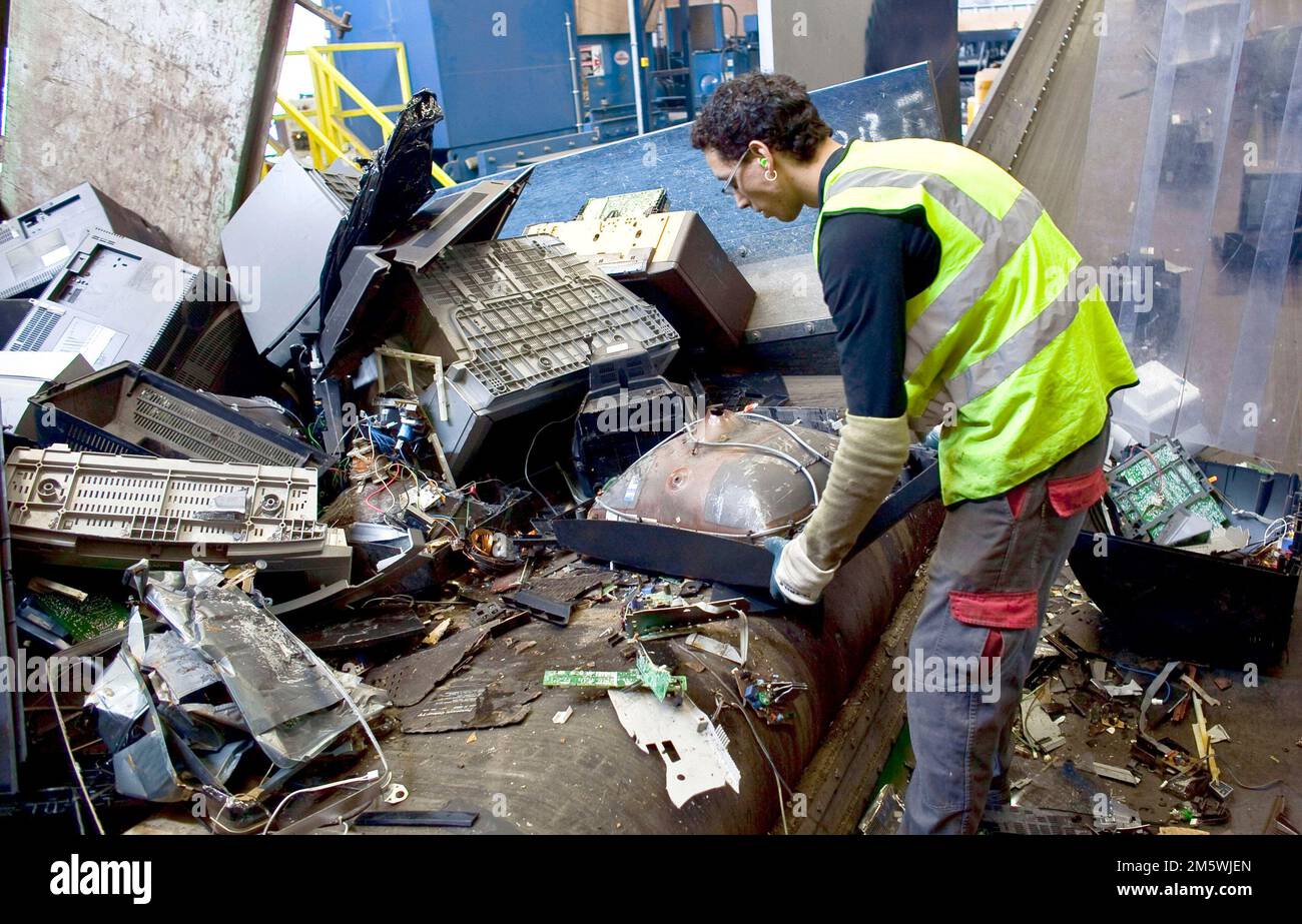 E-waste. Electronics recycling by sims, dismantling televisions ...