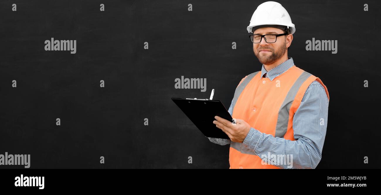 Male Engineer in a White Hard Hats and Orange West. Handsome Confident ...