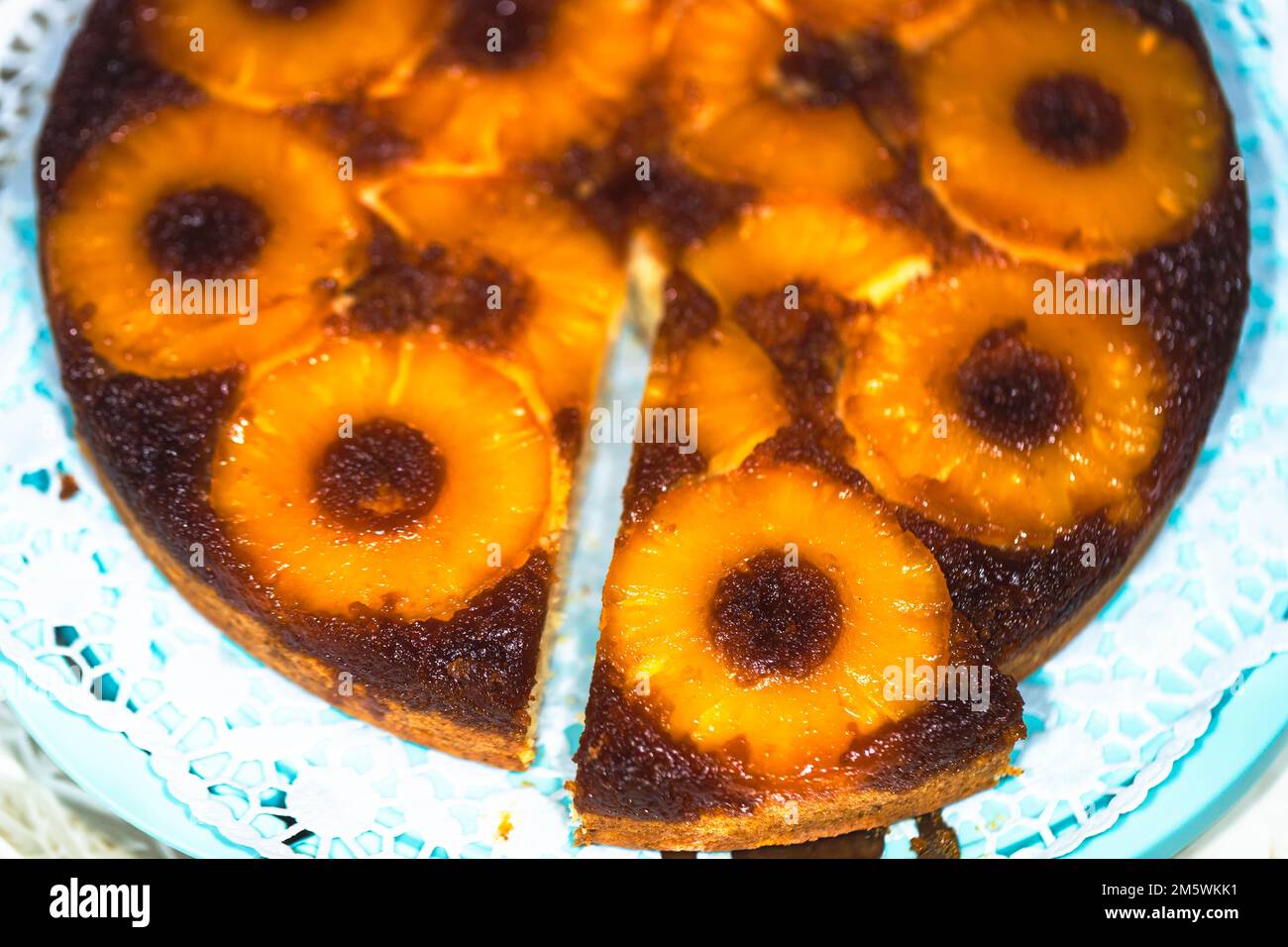 A succulent slice of pineapple upside-down cake, showcasing caramelized ...
