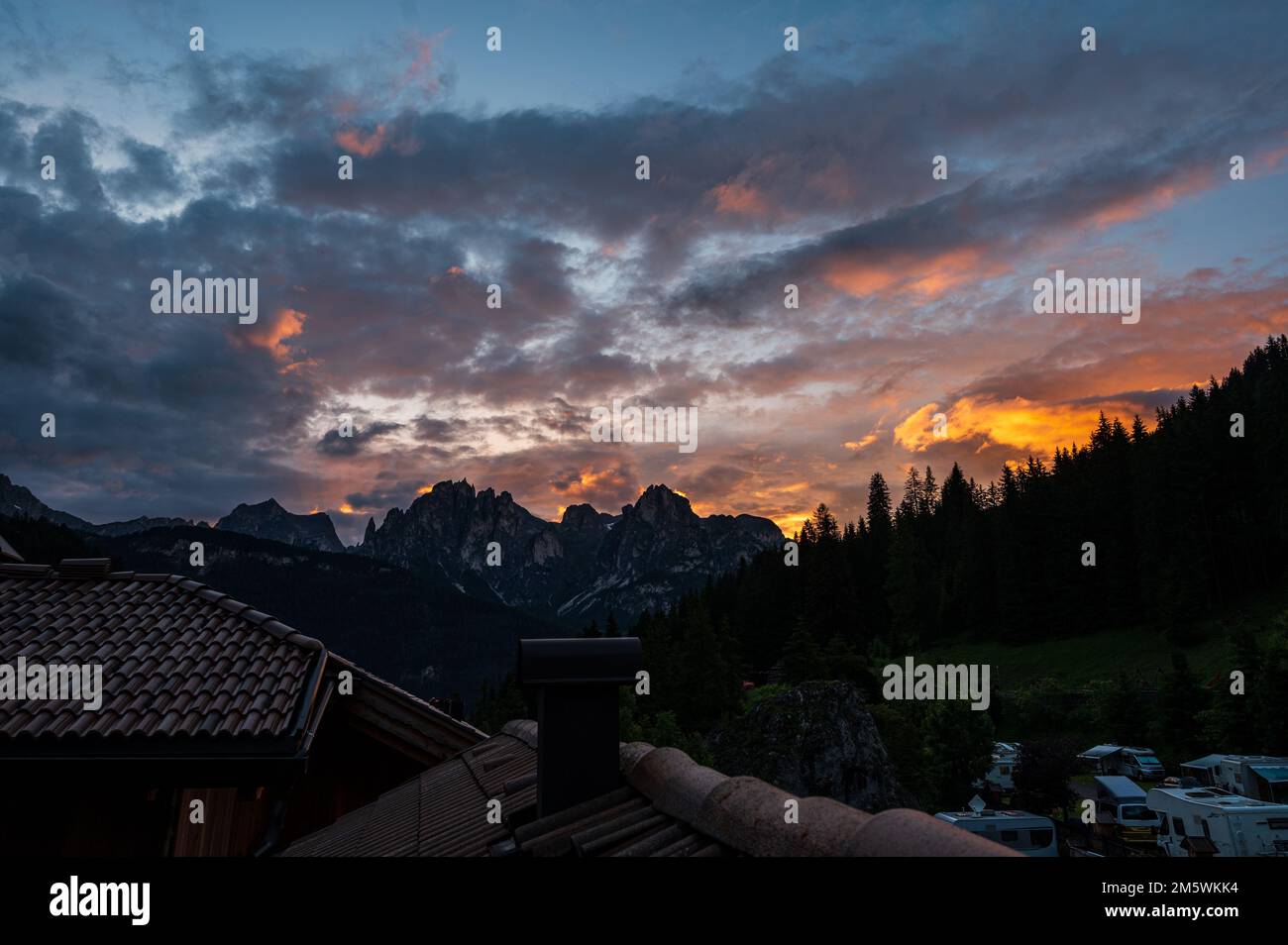 sunset over the Catinaccio mountain range seen from Pozza di Fassa, Val ...