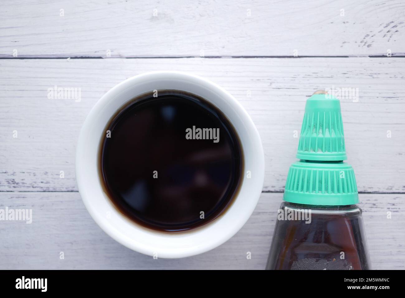 Bottle of maple syrup pouring close up Stock Photo - Alamy