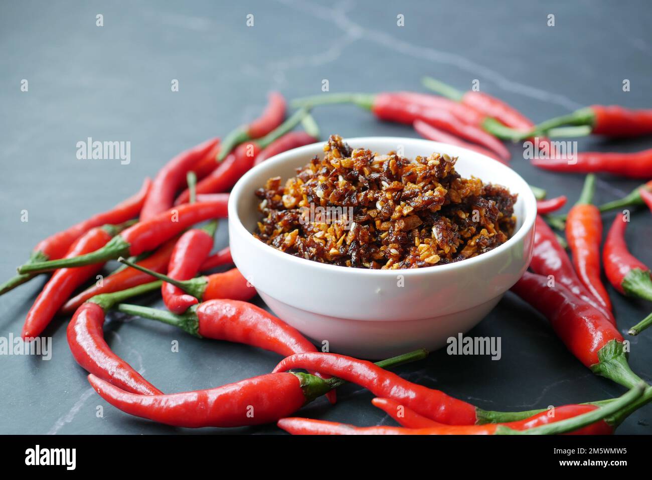 chili and garlic flakes in a container Stock Photo - Alamy