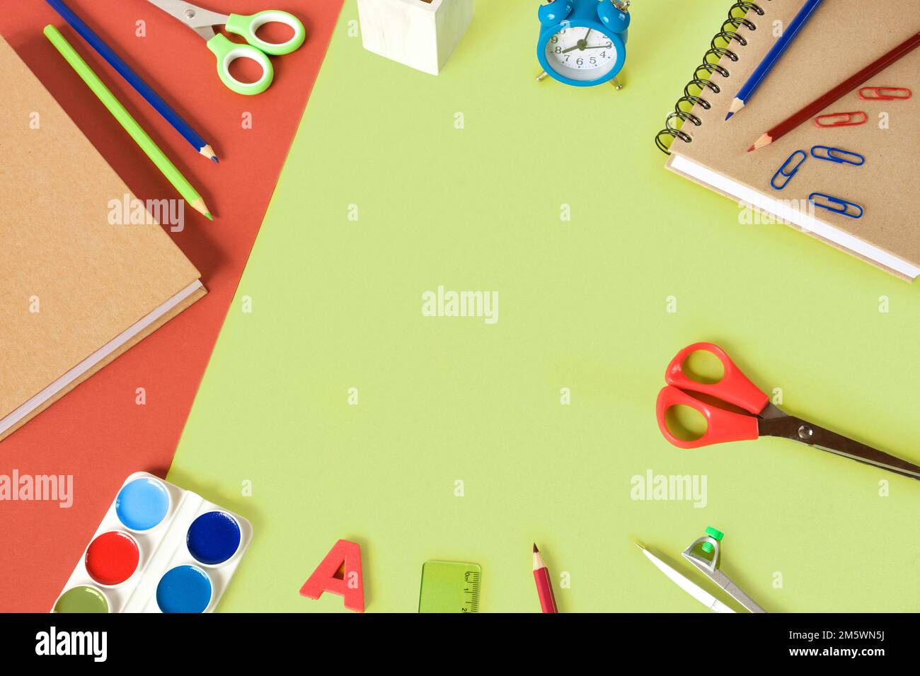 Colorful school supplies on light green background. Many Office ...