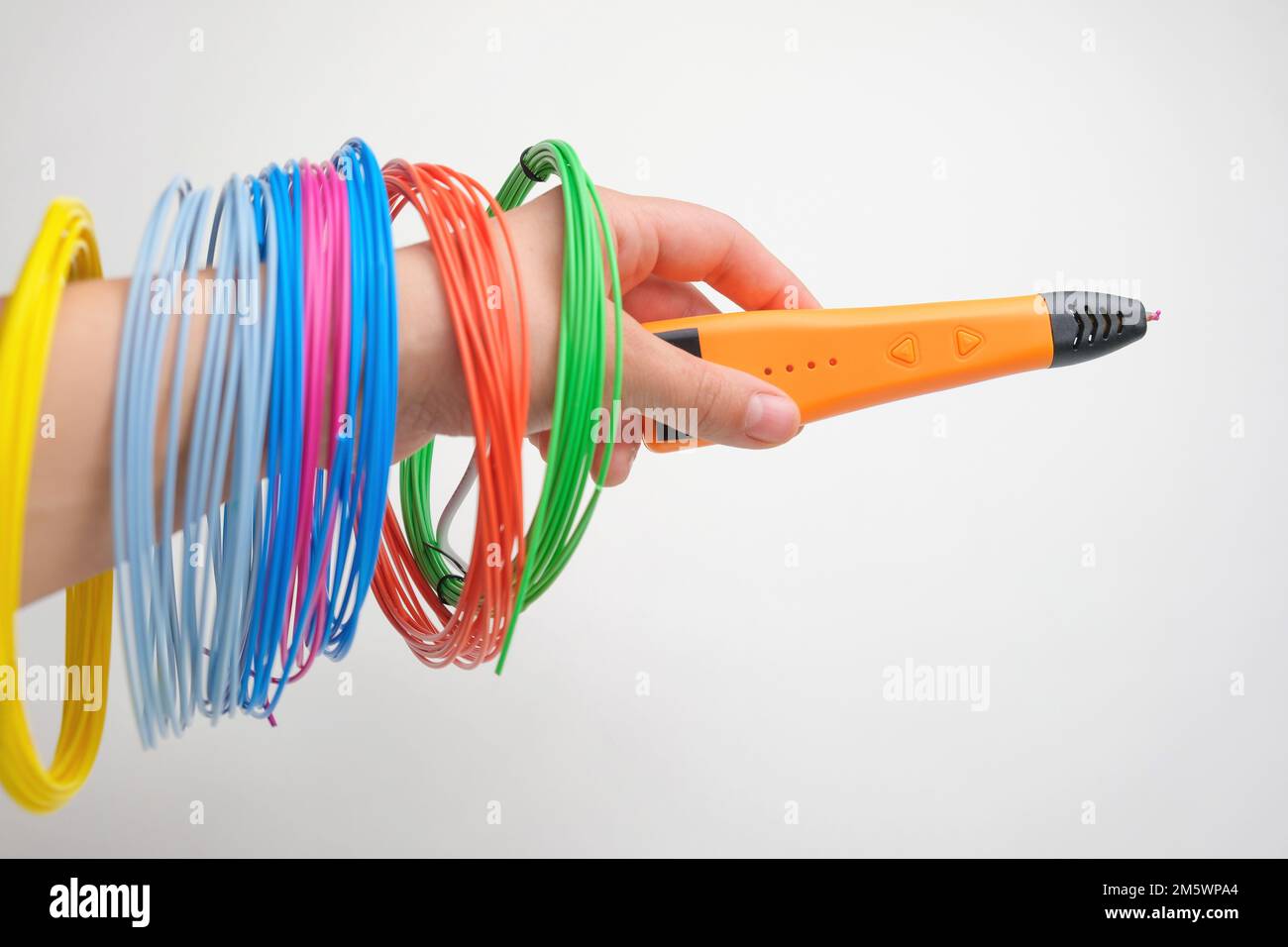 3d Pen. Printing with Colored Plastic Wire Filament. Child making a ...
