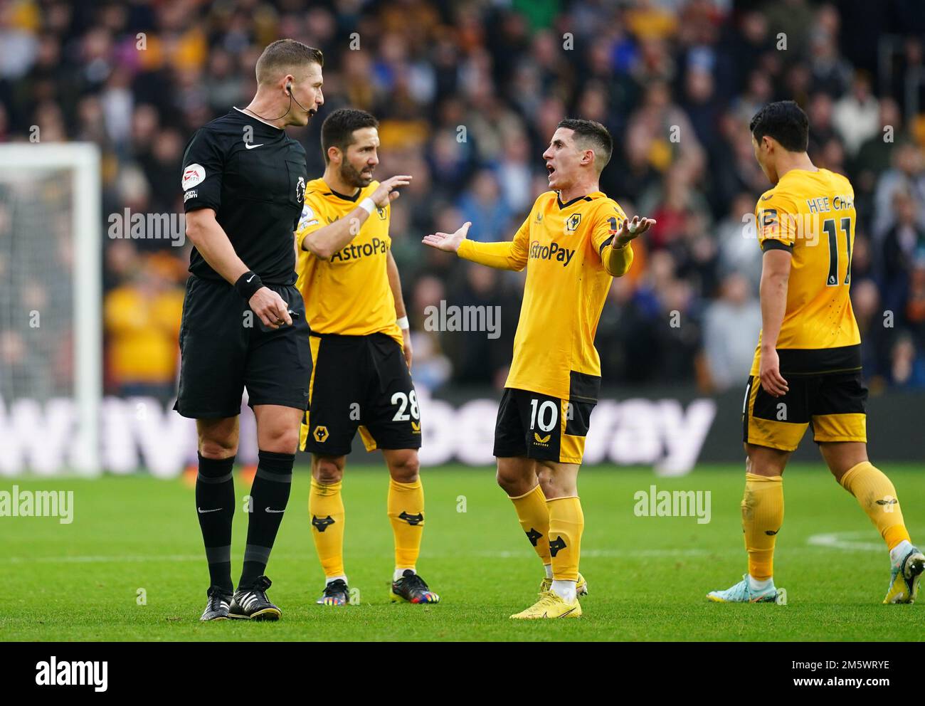 Wolverhampton Wanderers' Daniel Podence protests to referee Robert ...