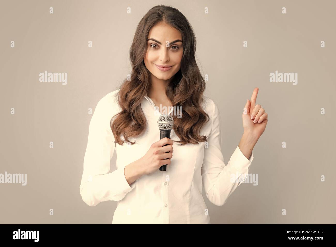 Microphone speech speaking concept. Young beautiful woman singing song ...