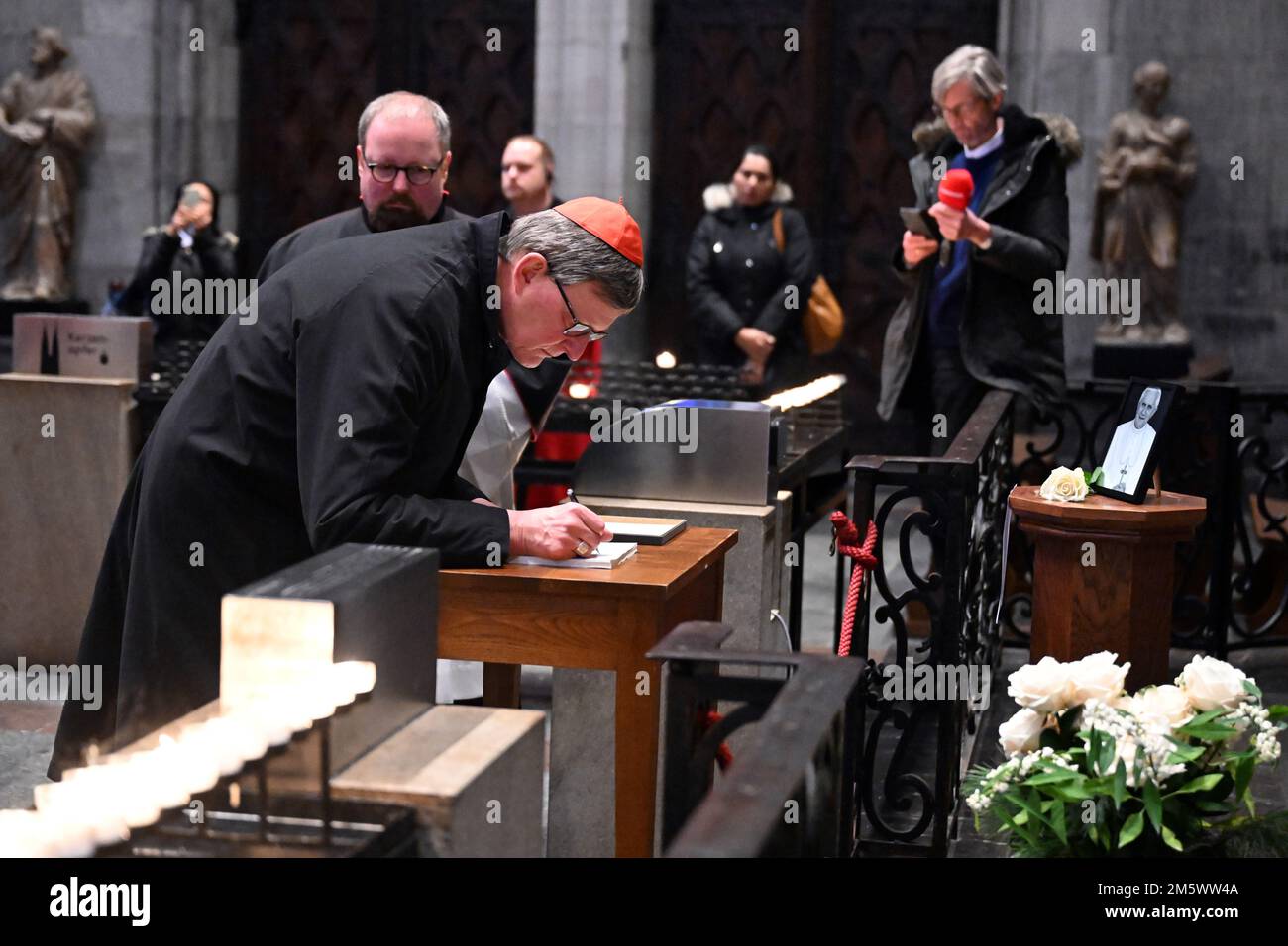 Cologne, Germany. 31st Dec, 2022. Cardinal Rainer Maria Woelki signs ...