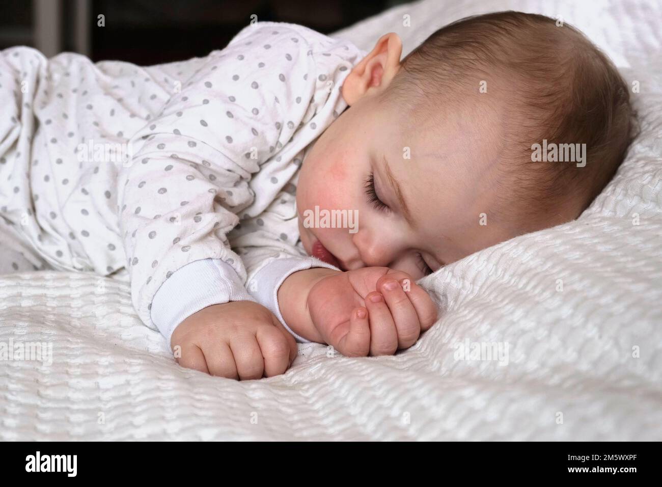 Peaceful adorable baby sleeping on his bed at home. Sleeping newborn ...