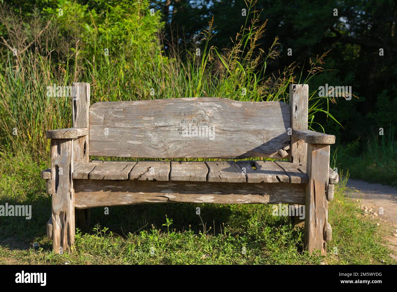 Weathered antique brown bench in forest Stock Photo - Alamy