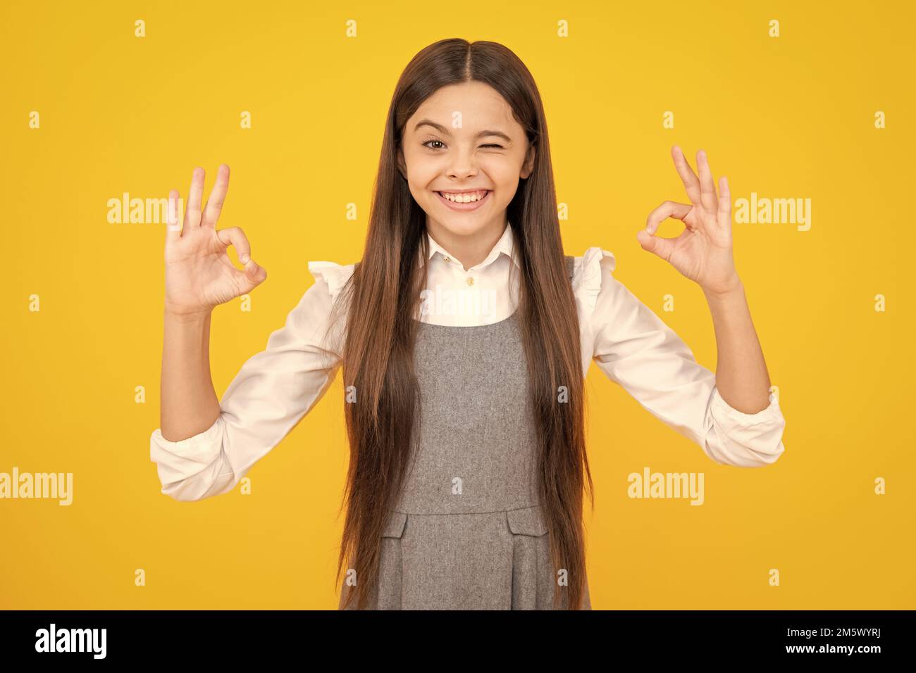 Emotional portrait of caucasian teen girl. Funny teenager making ok ...