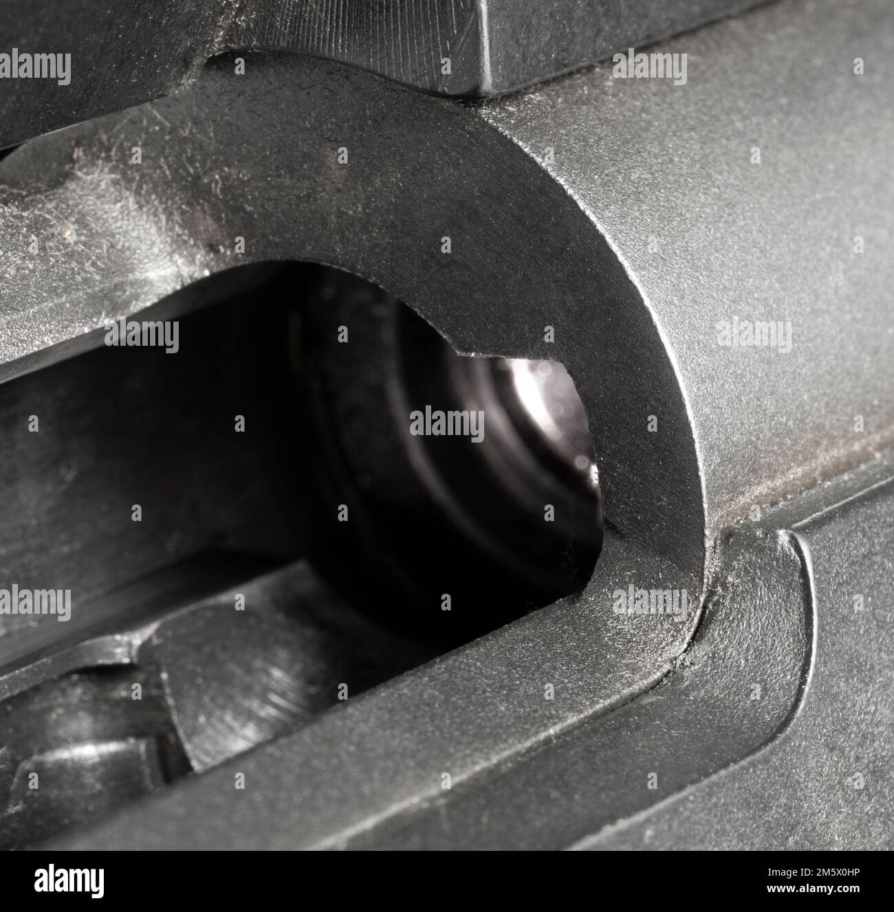 Empty chamber on a bolt action rifle with light shiniing through Stock ...