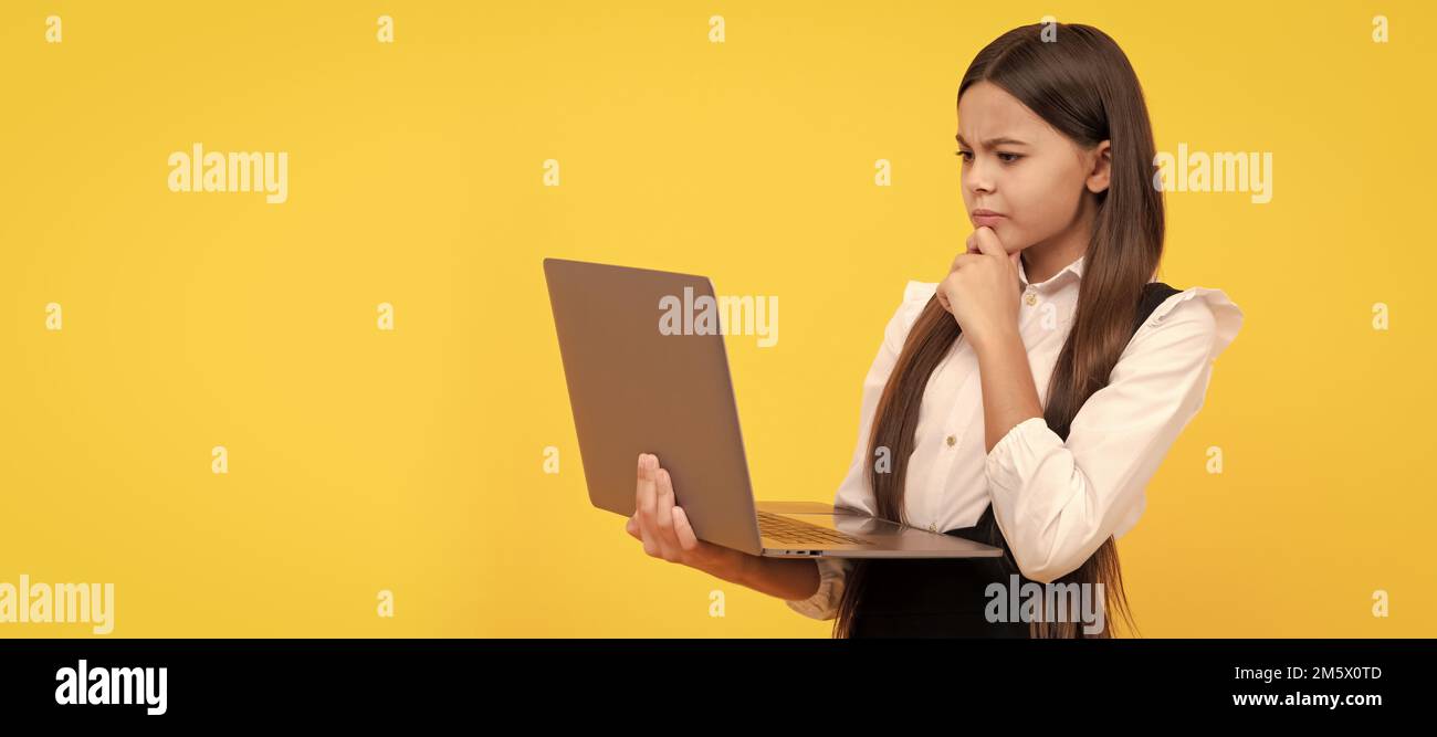 concentrated serious teen girl in school uniform study on laptop ...