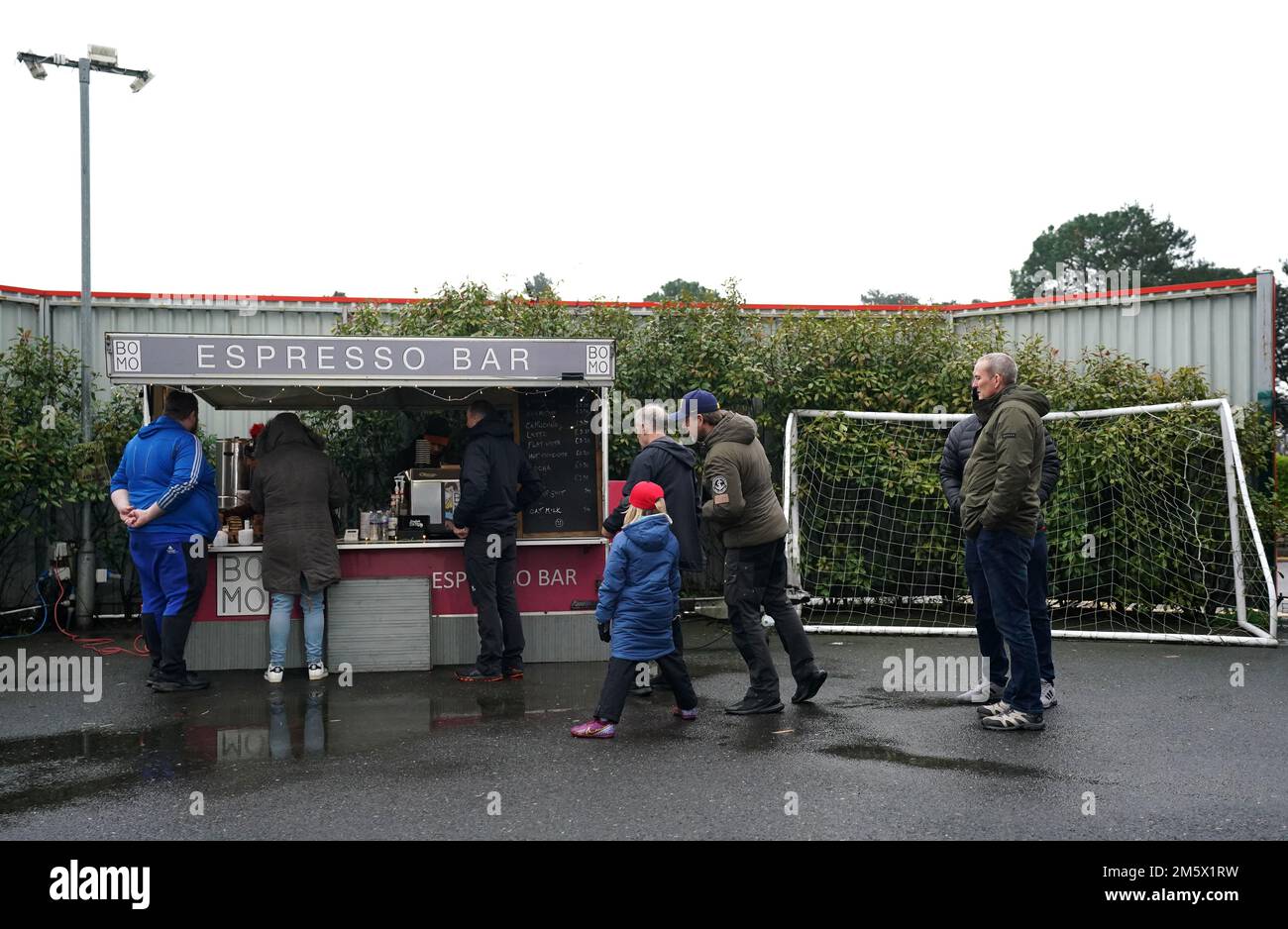 Fans queue at an espresso bar ahead of the Premier League match at the ...