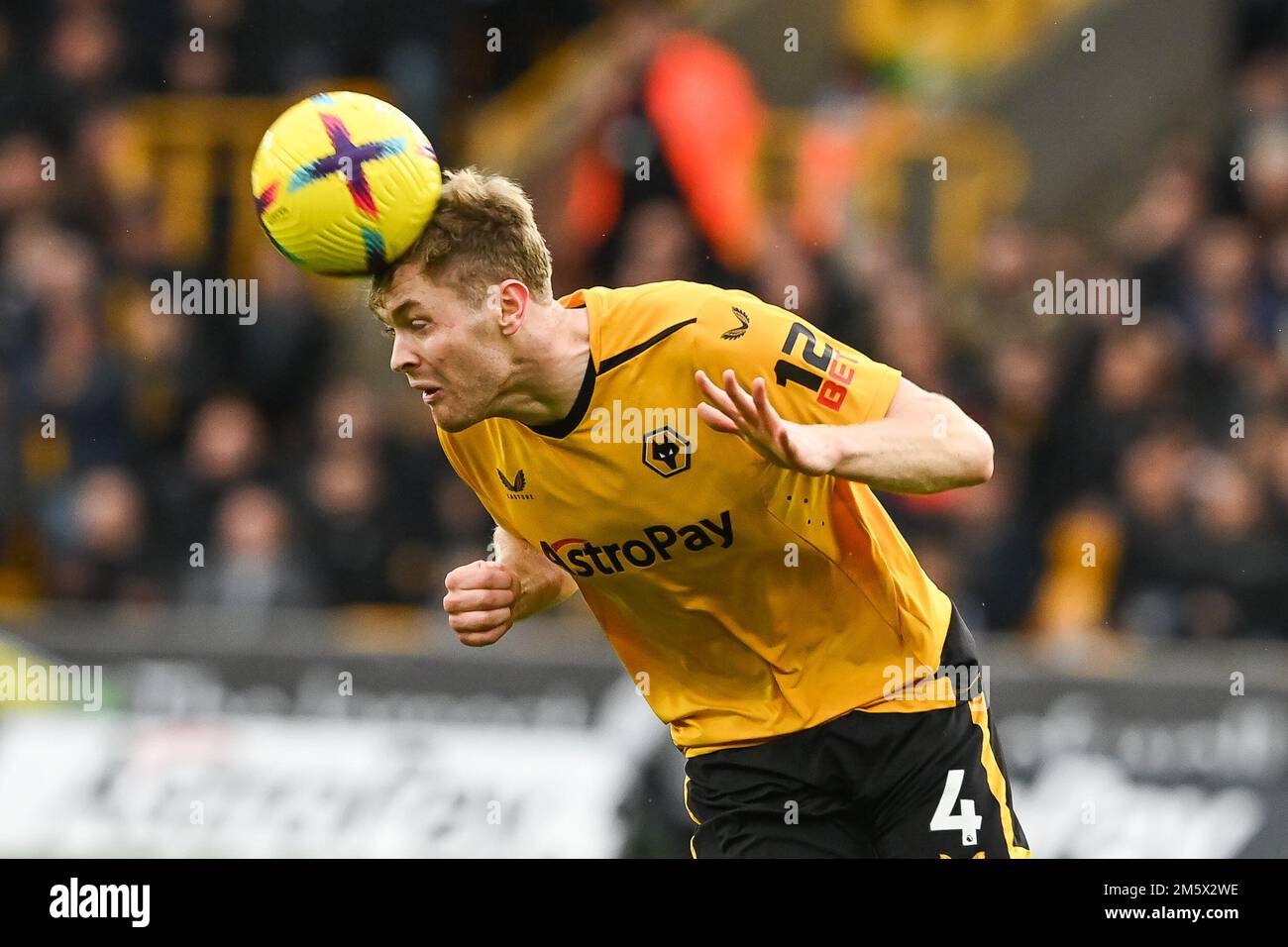 Nathan Collins #4 of Wolverhampton Wanderers heads clear during the ...
